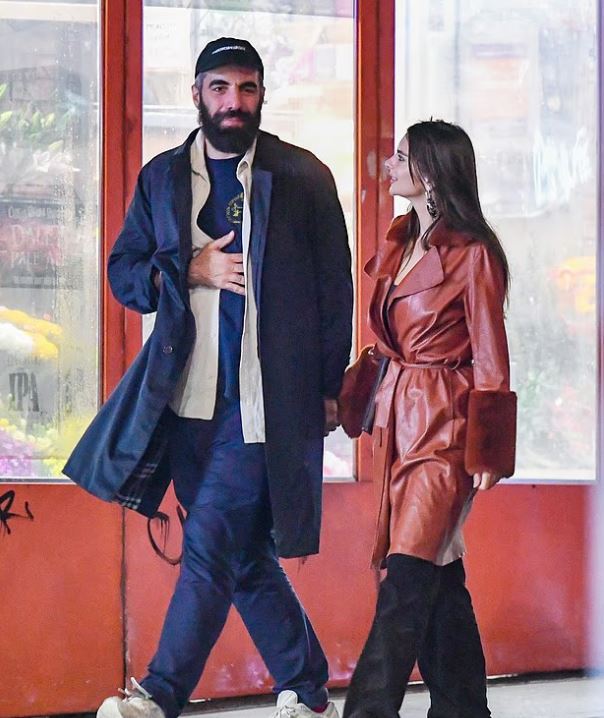The photos show the two walking hand in hand, laughing and exchanging ...